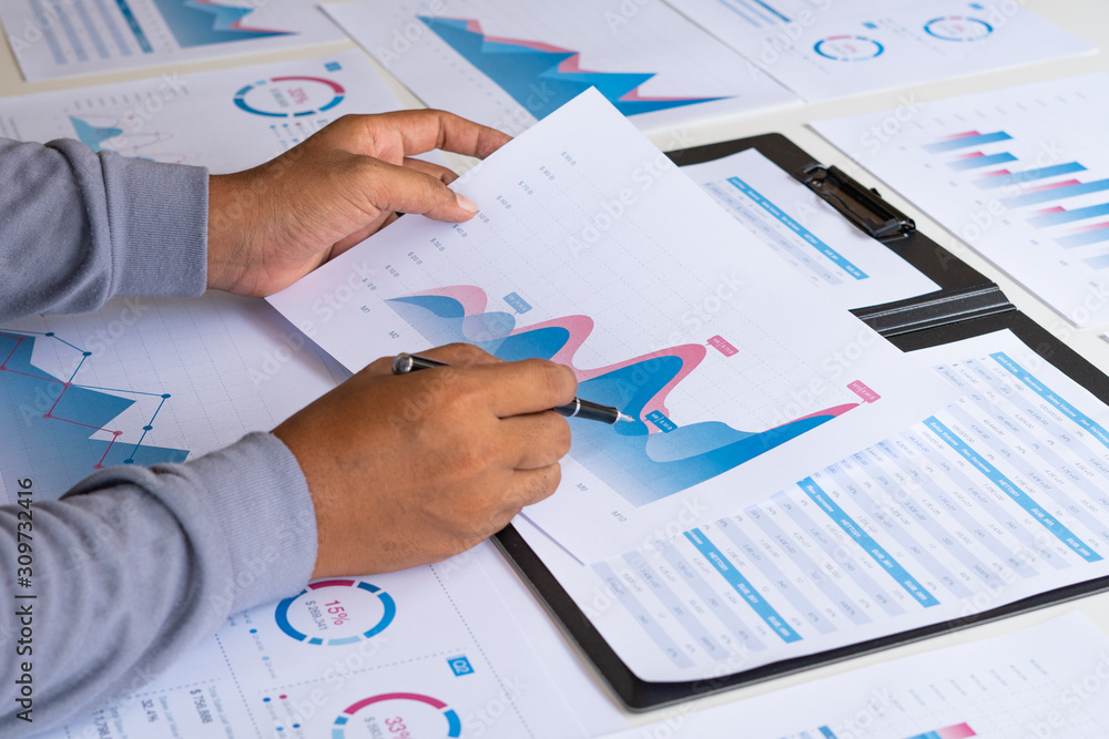 businessman working calculate data document graph chart report ...