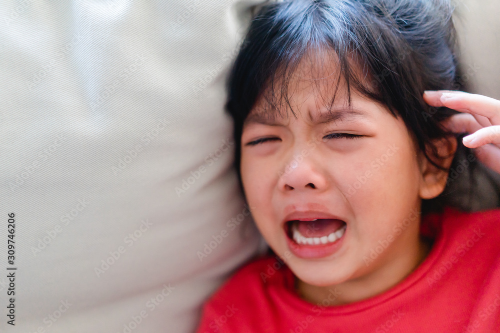 Foto de Stock Emotional Crying and Sad Angry little girl at home.Mad ...