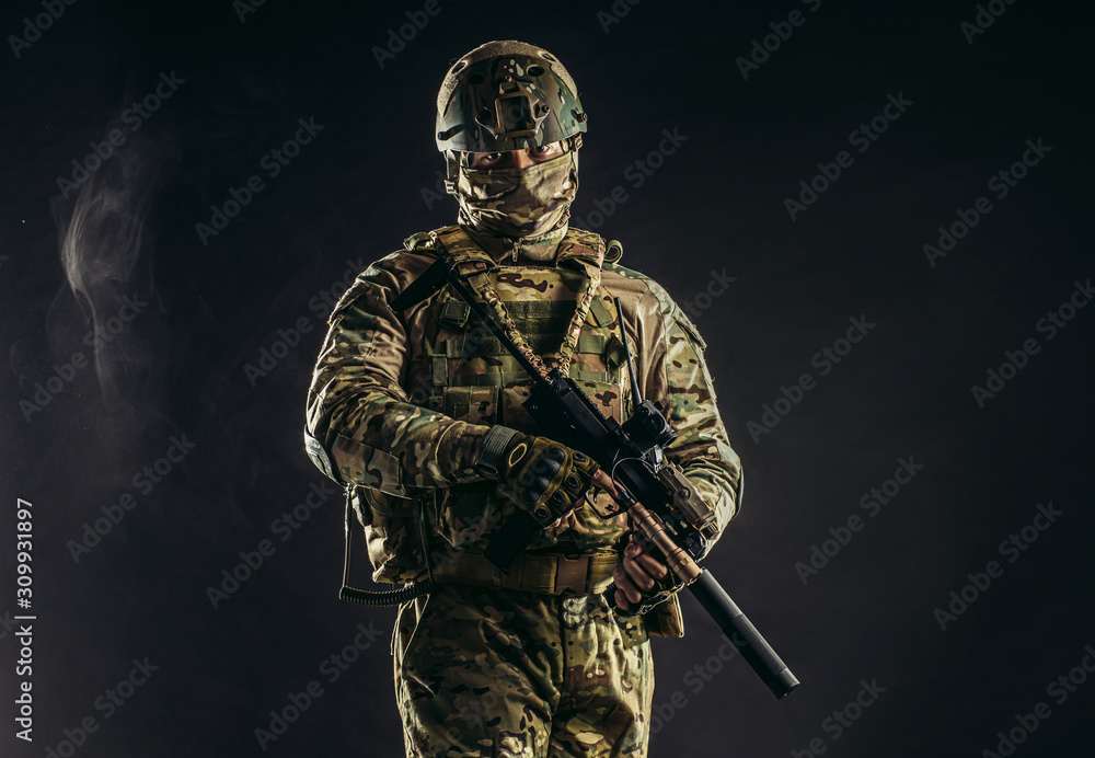 brave strong and confident man soldier wearing army clothes, green ...