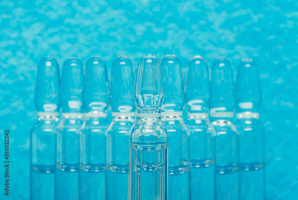 Glass medical ampoule vial for injection. Medicine is liquid sodium ...