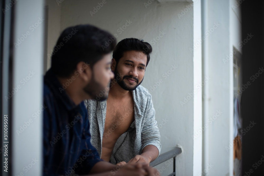 Two young tall, dark and handsome Indian Bengali men in western jackets ...