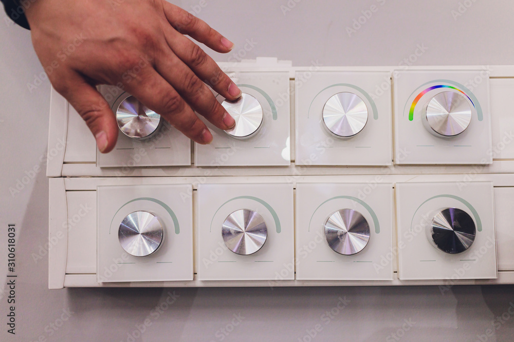 moderm switch control in hotel room Finger pressing light switch. Stock ...