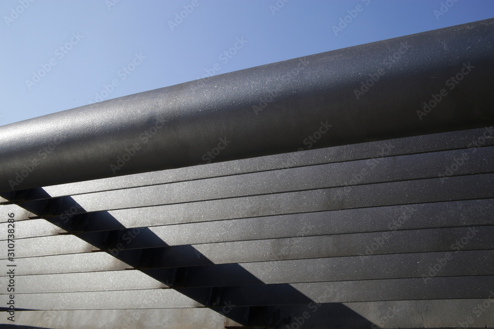 Metal girder lath structure. Detail of industrial building. Abstract ...
