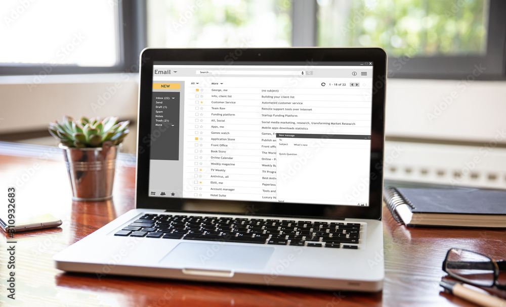 Emails list on a laptop screen, office workspace Stock Photo | Adobe Stock