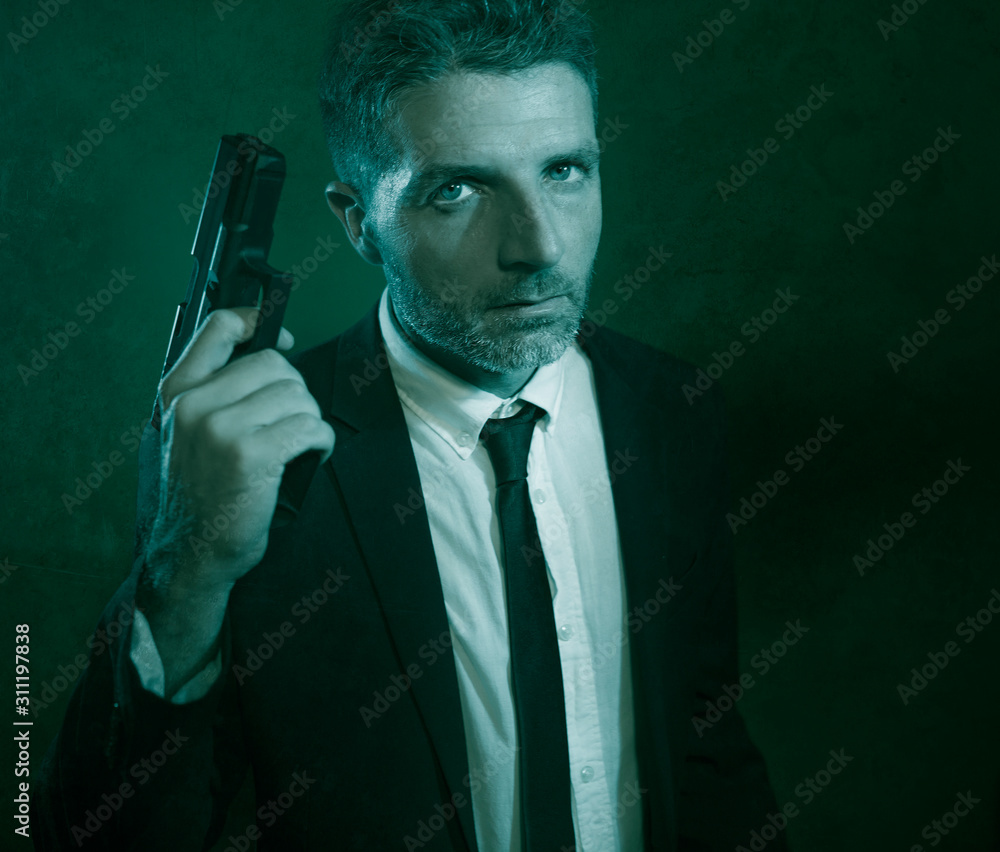 Man pointing handgun dramatic action portrait of attractive special ...