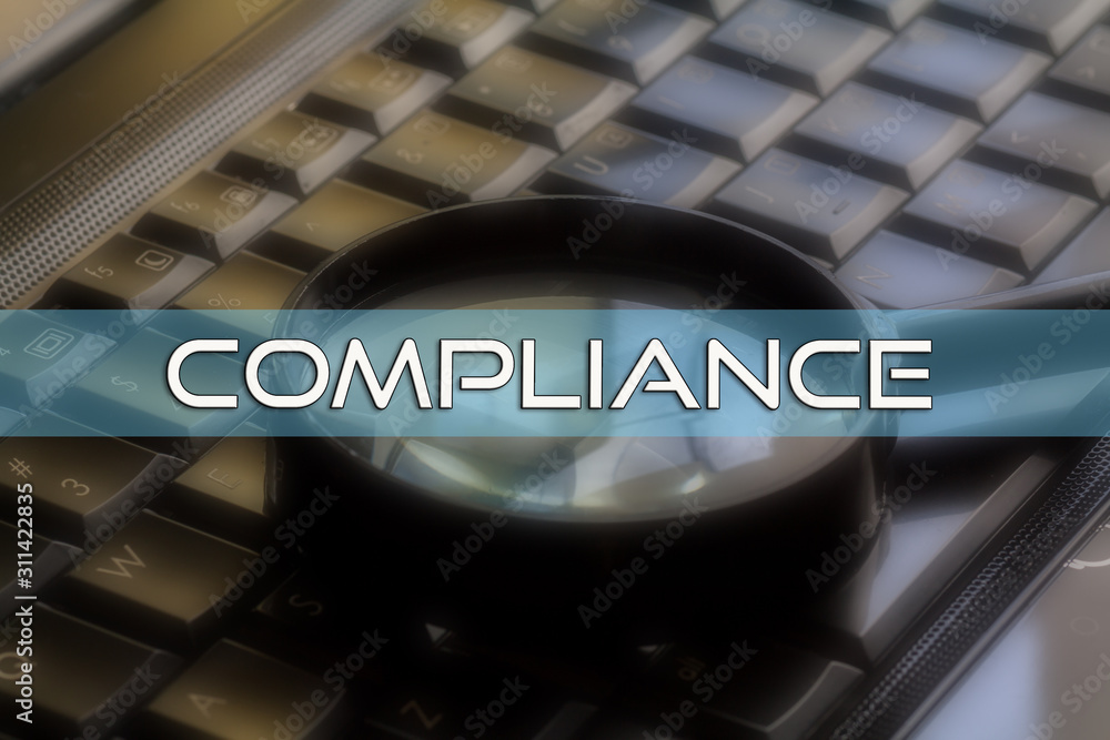 COMPLIANCE word written on blur background of magnifier glass and ...