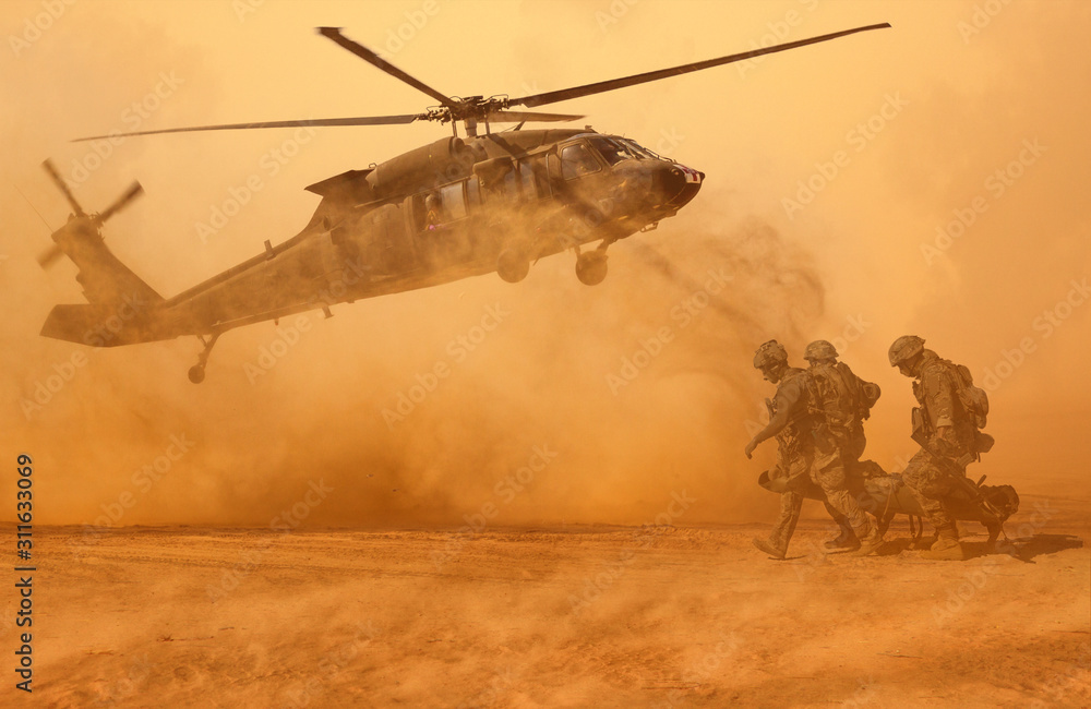 Army Soldiers carrying patient to the aircraft in the battle field ...
