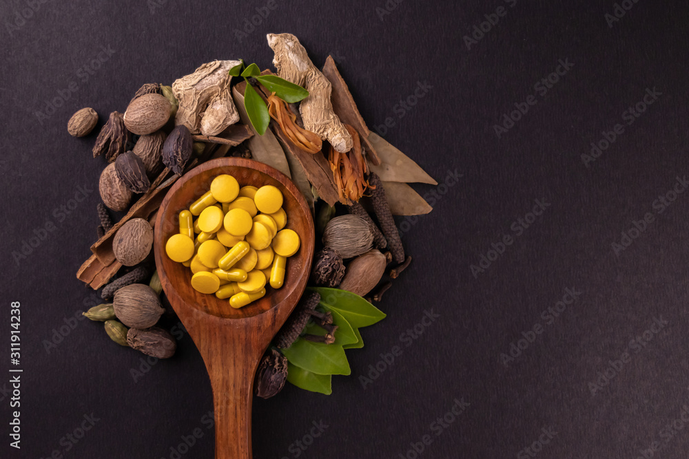 Alternative medicine concept. Close-up view of yellow herbal drugs in a ...
