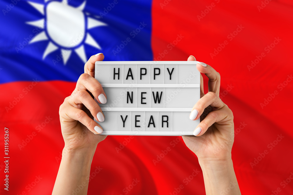 Taiwan New Year concept. Woman holding Happy New Year sign with hands ...