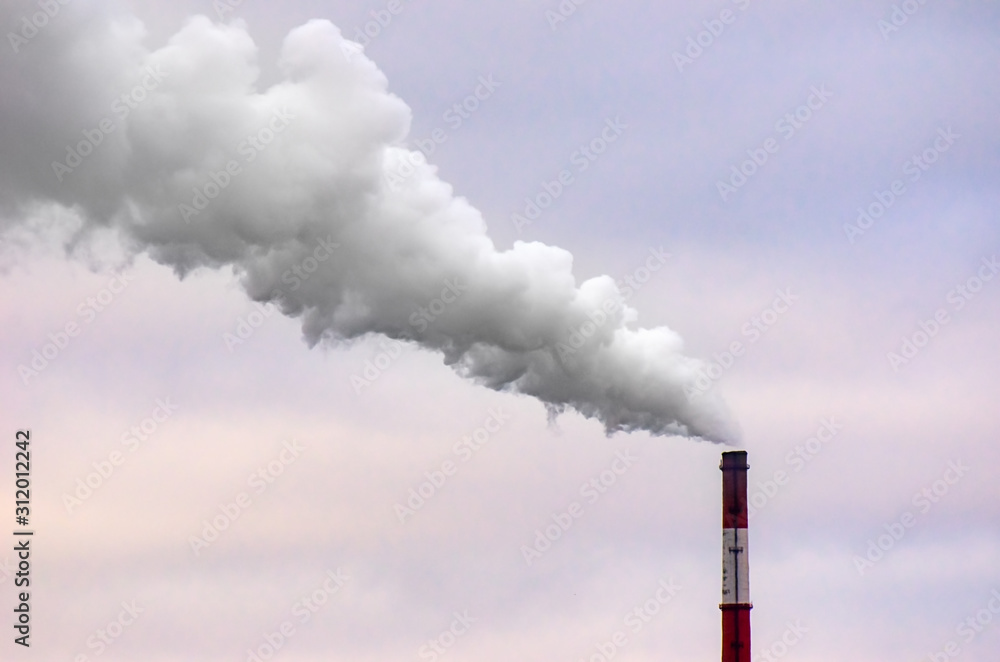 Smoking Tall Industrial Chimney on a Windy Overcast Day. Stock Photo ...