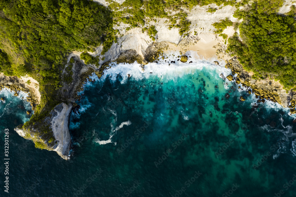 Stunning aerial view of a green limestone cliff with a beautiful wild ...