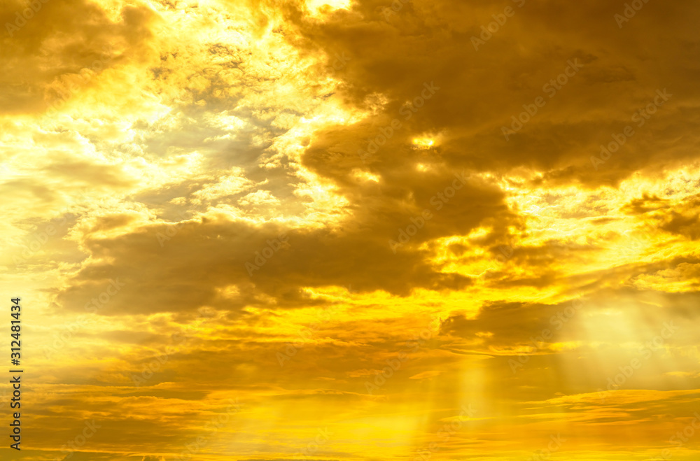 God light. Dramatic golden cloudy sky with sun beam. Yellow sun rays ...