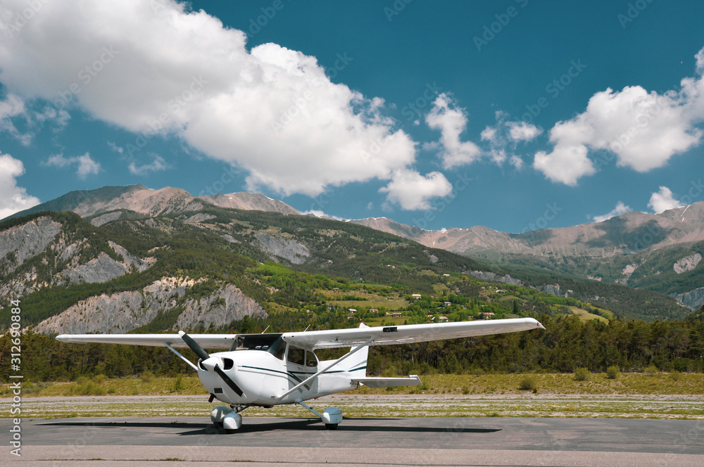 Single engine piston Cessna 172 parked at an airfield in the mountains ...