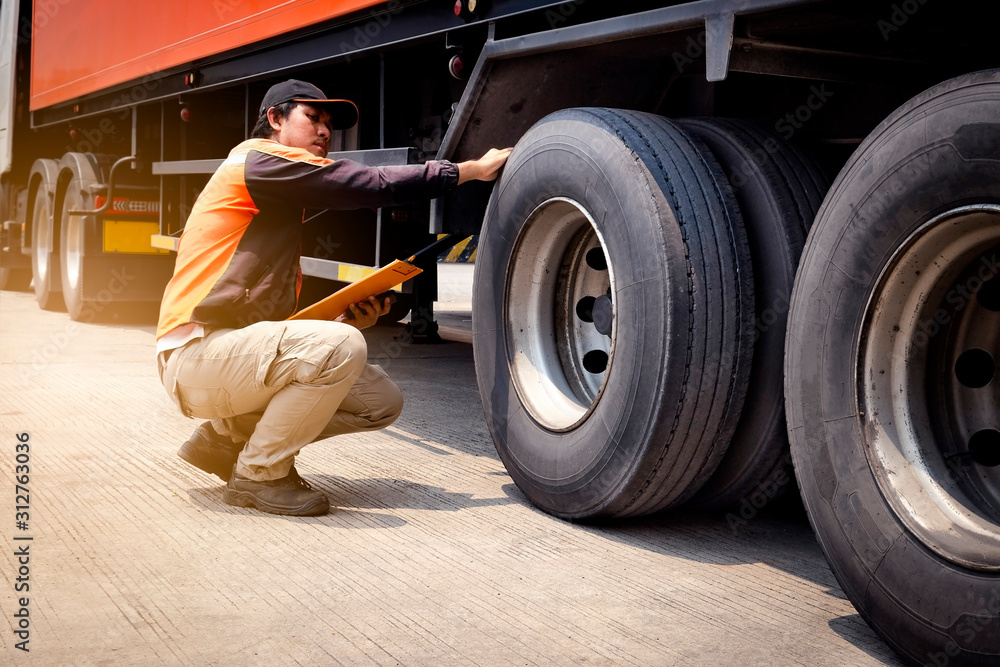 Auto Mechanic is Checking the Truck's Safety Maintenance Checklist ...
