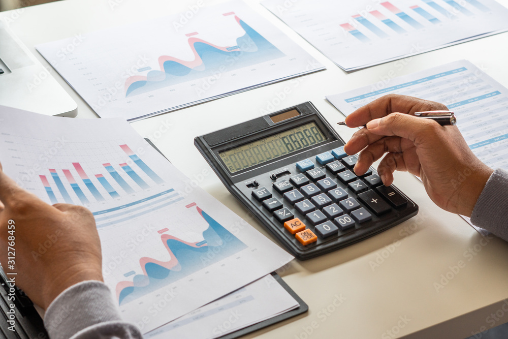 businessman working calculate data document graph chart report ...