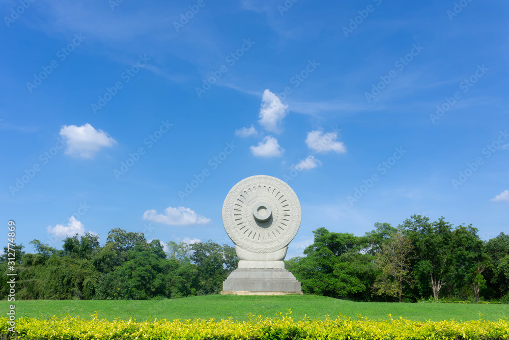 Dharmachakra or Wheel of Dhamma of buddhism buiding from sand stone ...
