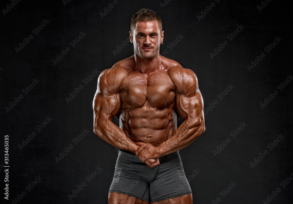 Bodybuilder Flexing Muscles, Studio Shots Stock Photo | Adobe Stock