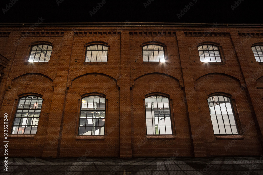Facade of a vintage old red brick warehouse, used from an Industrial ...