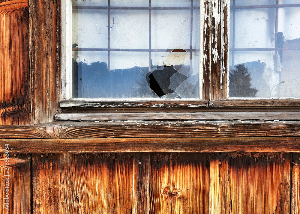 Lost Place - close-up view - rusted grille behind broken double glass ...