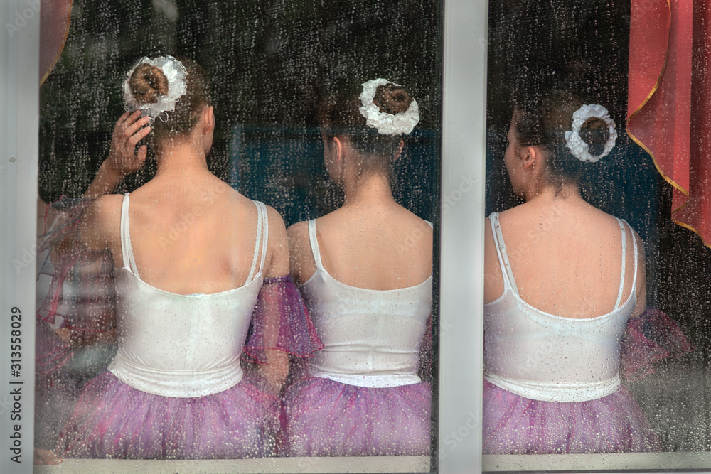 girls in ballet costumes are sitting on the windowsill Stock Photo ...
