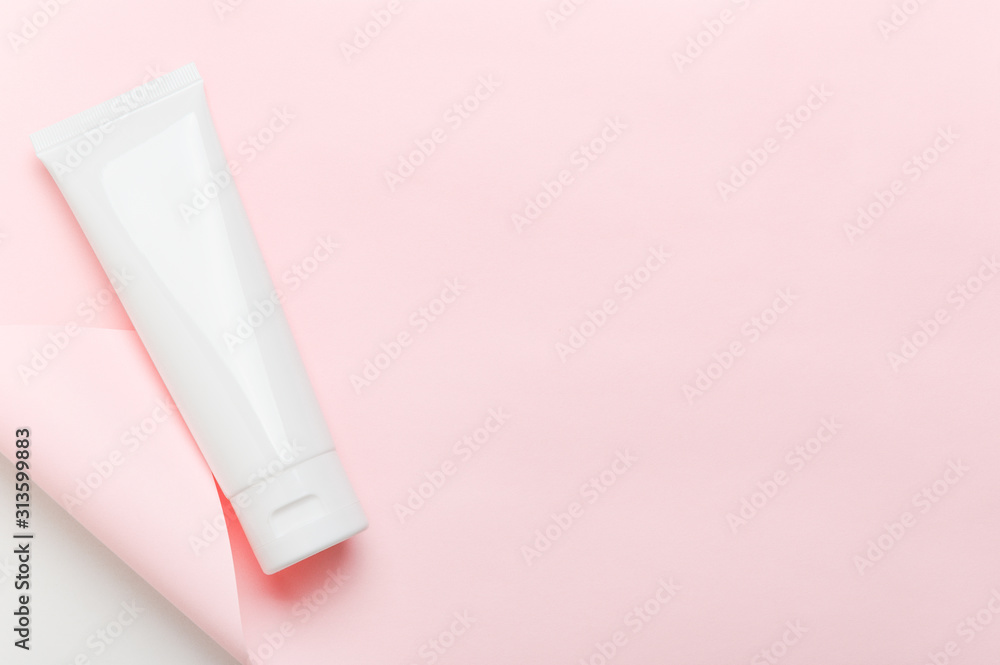 Feminine hygienic product tube on pastel pink background. Shampoo, hand ...
