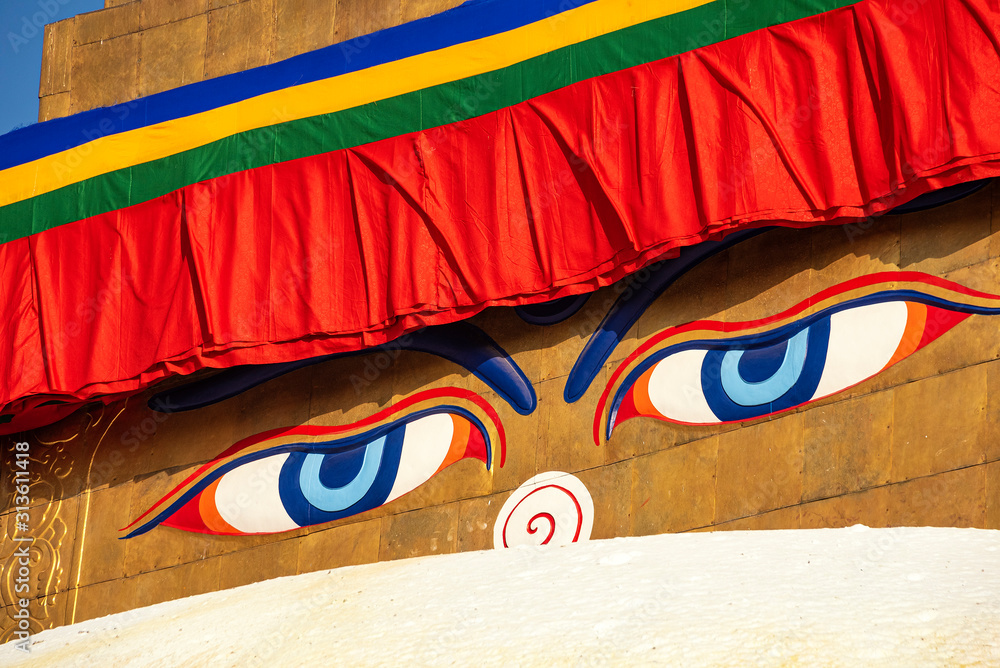 Buddha eyes close up with prayer flags at Boudhanath stupa in Kathmandu ...