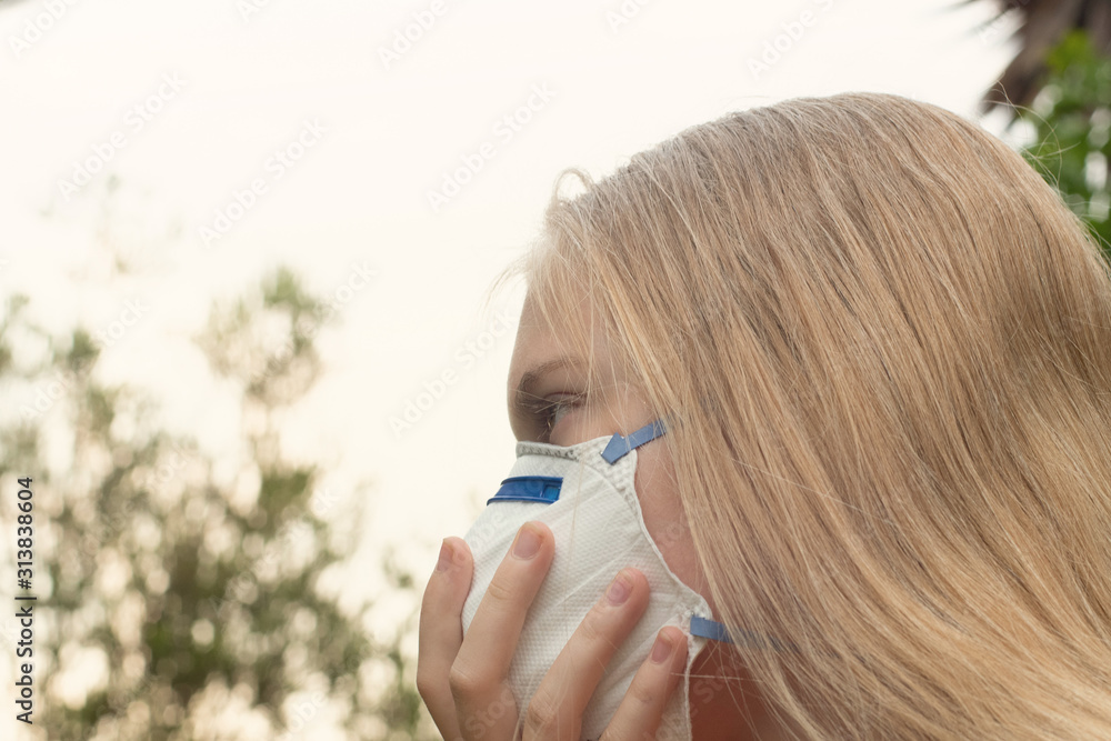 Australian bushfire: blond girl wearing P2 N95 protection respiratory ...