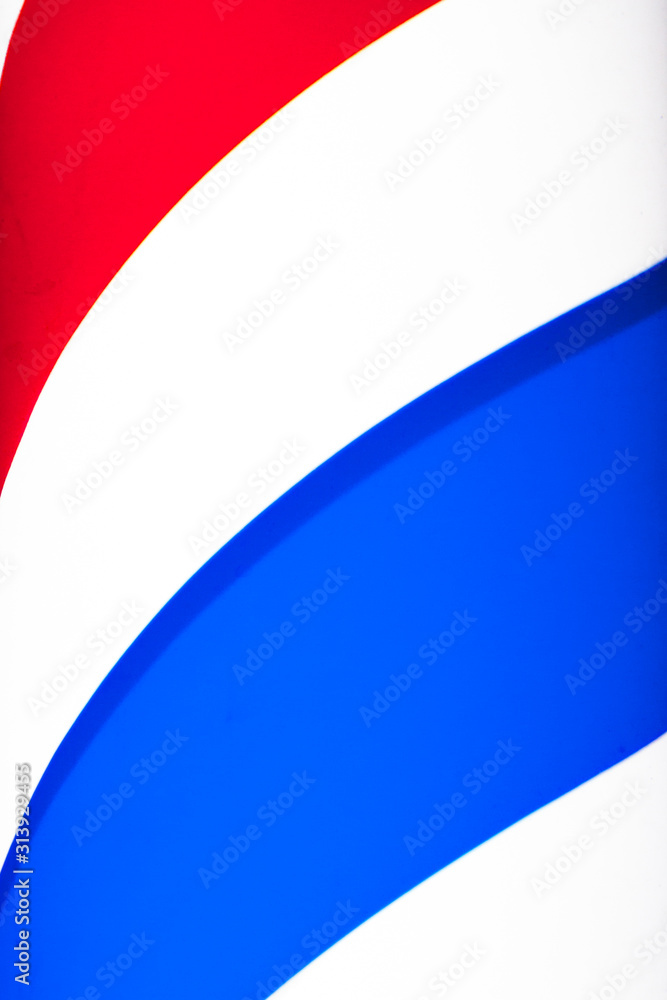 Barber pole, the symbol of barbershop, colorful texture of bright ...