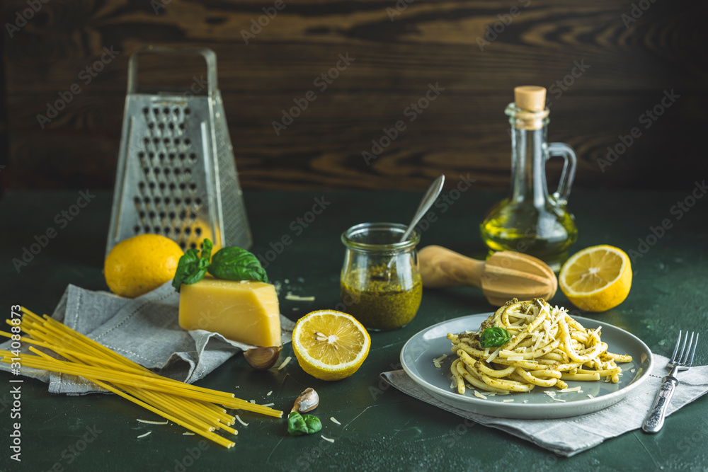 Spaghetti pasta bucatini with pesto sauce and parmesan. Italian ...