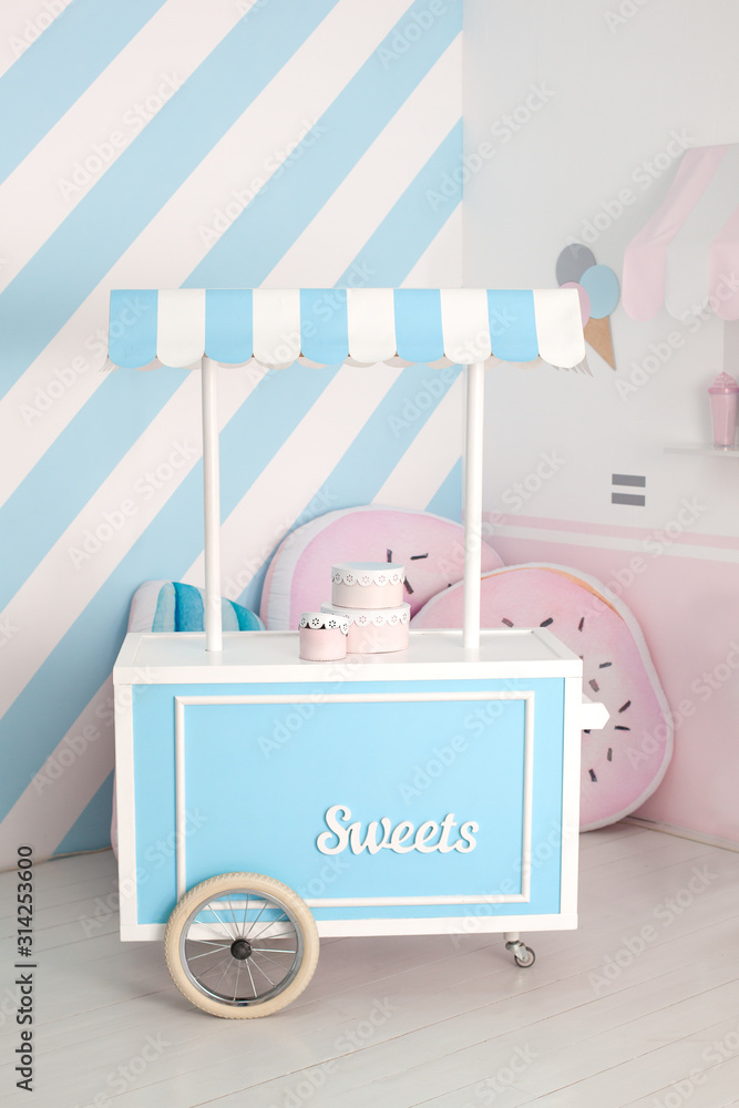 Cart with Candy Bar. Children zone with sweets: lollipops, ice cream ...