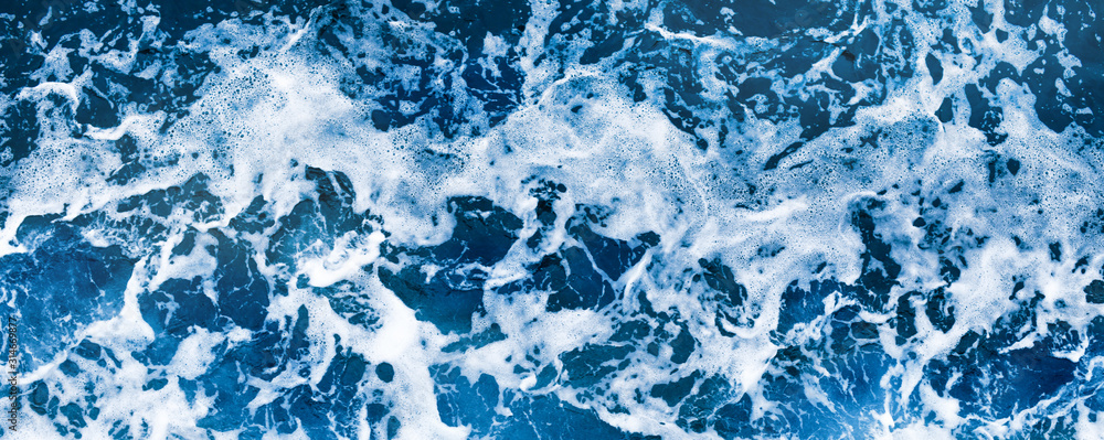 Aerial view of salt ocean foam and waves. Blue water aqua sea ...