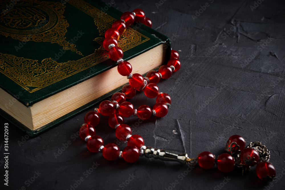 Faith in Islam concept. The Islamic holy book, Quran or Kuran, with ...