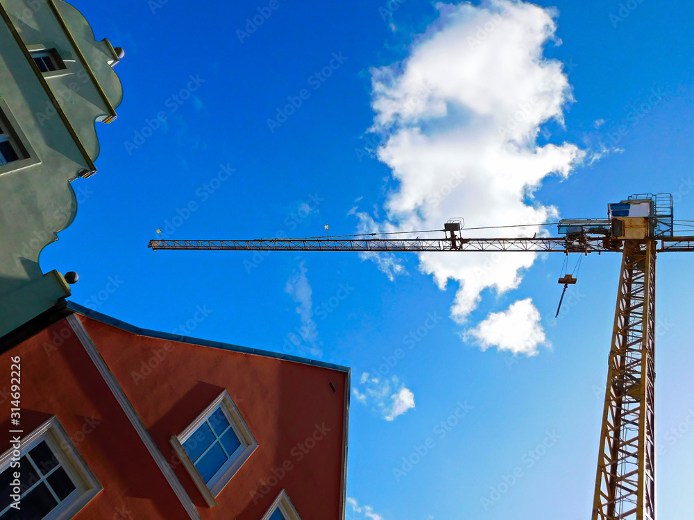Crane work in a historic old town Stock Photo | Adobe Stock