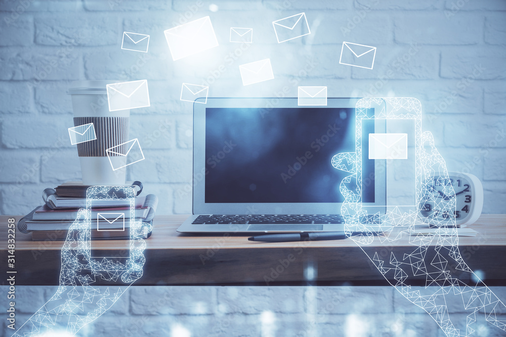 Desktop computer background in office and flying envelops hologram ...