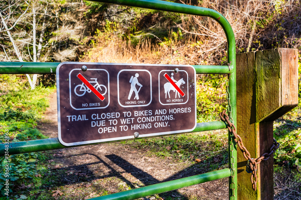 Sign posted at the entrance on one of the trails opened only to hiking ...