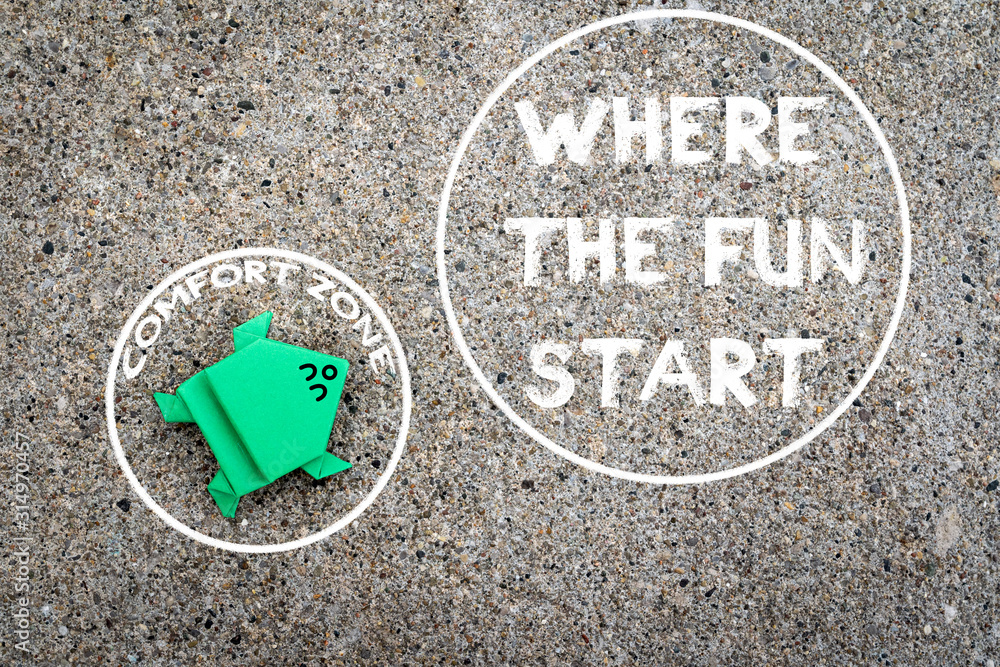 Exit from the comfort zone concept. Dark green frog jump out of the ...