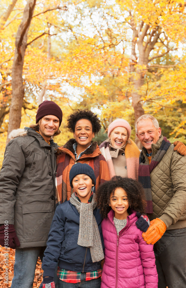 Portrait smiling multi-generation family in autumn woods Stock Photo ...