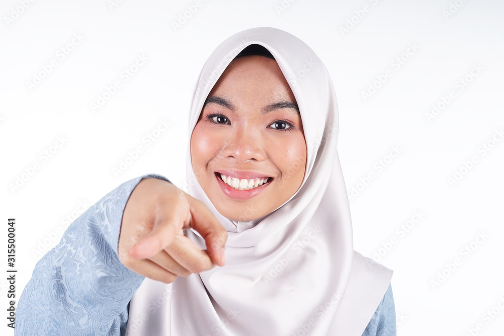 Headshot of a cute Muslim teenager wearing hijab showing various facial ...