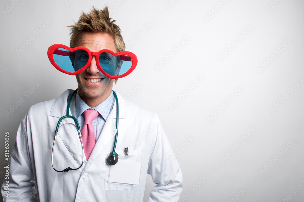 Love Doctor wearing white lab coat and stethoscope smiling behind big ...