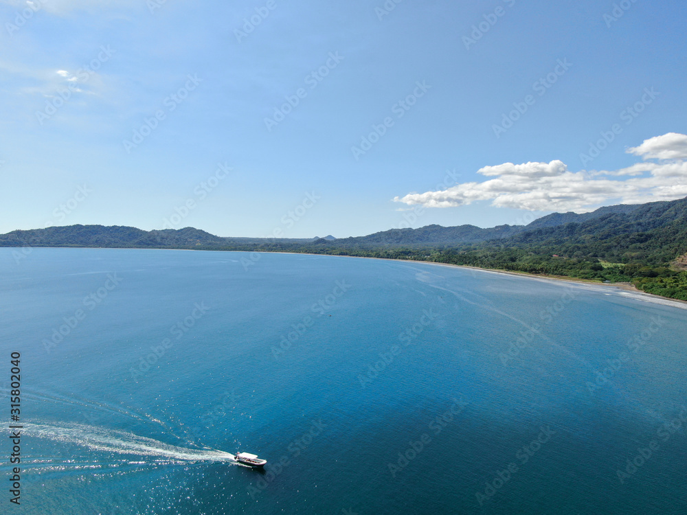 Open views of Tambor Bay, Costa Rica with a Boat in the water Stock ...