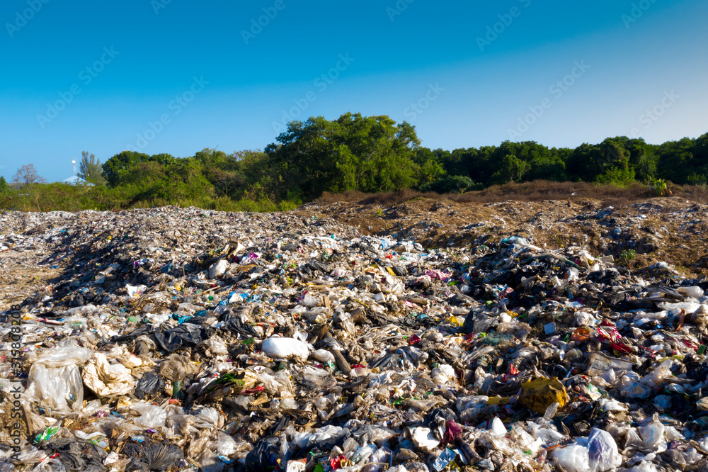 Plastic pollution in a landfill garbage dump Stock Photo | Adobe Stock
