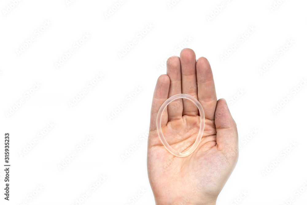 Birth control ring in a womans hand isolated on white background ...