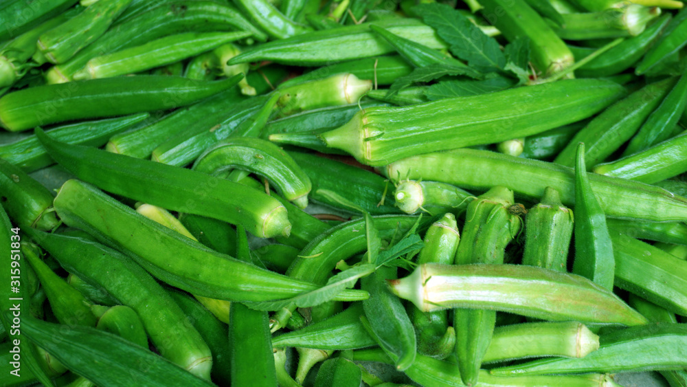 Ladyfingers are the edible seedpods of the okra plant (Abelmoschus ...