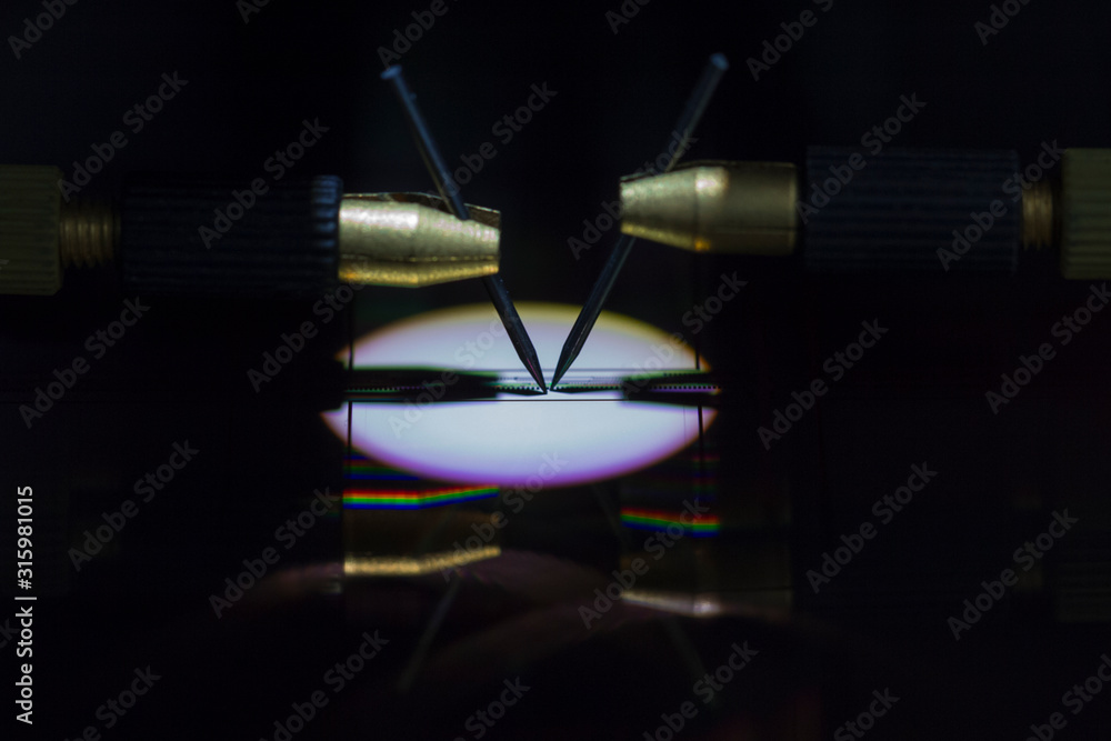 Manual probe system with needles for test of semiconductor on silicon ...