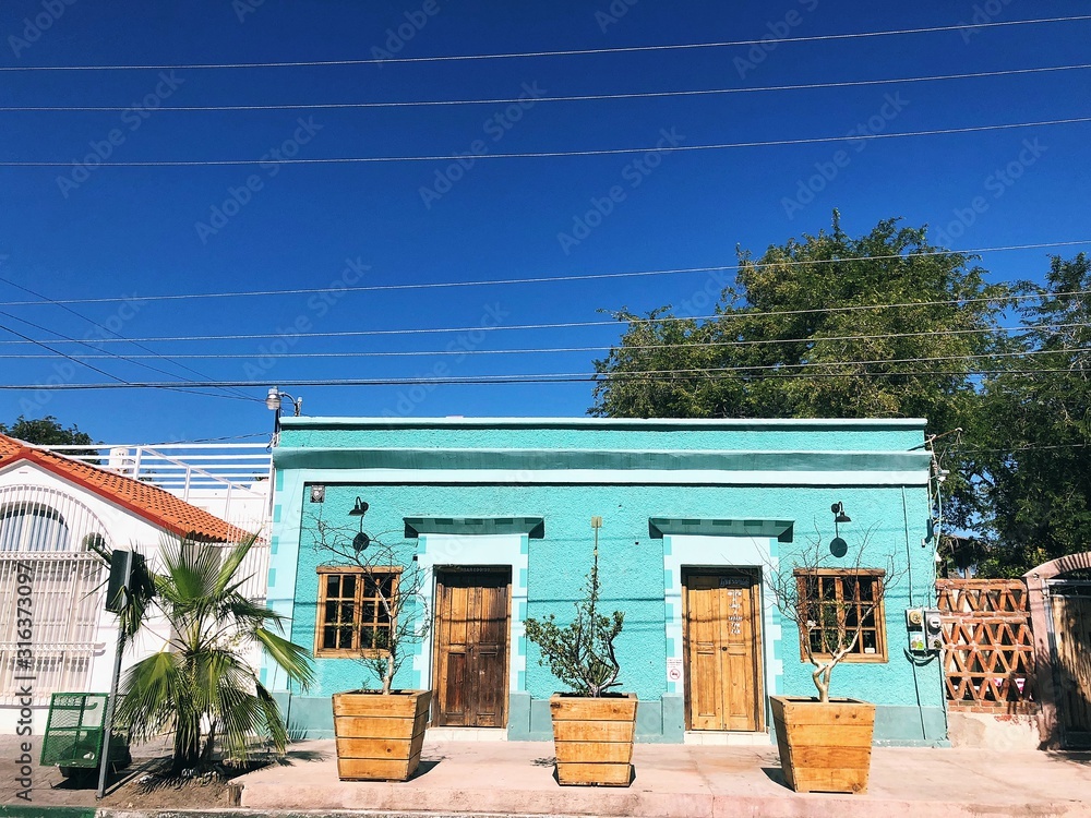 Traditional Mexican building/ light blue house/ La Paz Mexico street ...