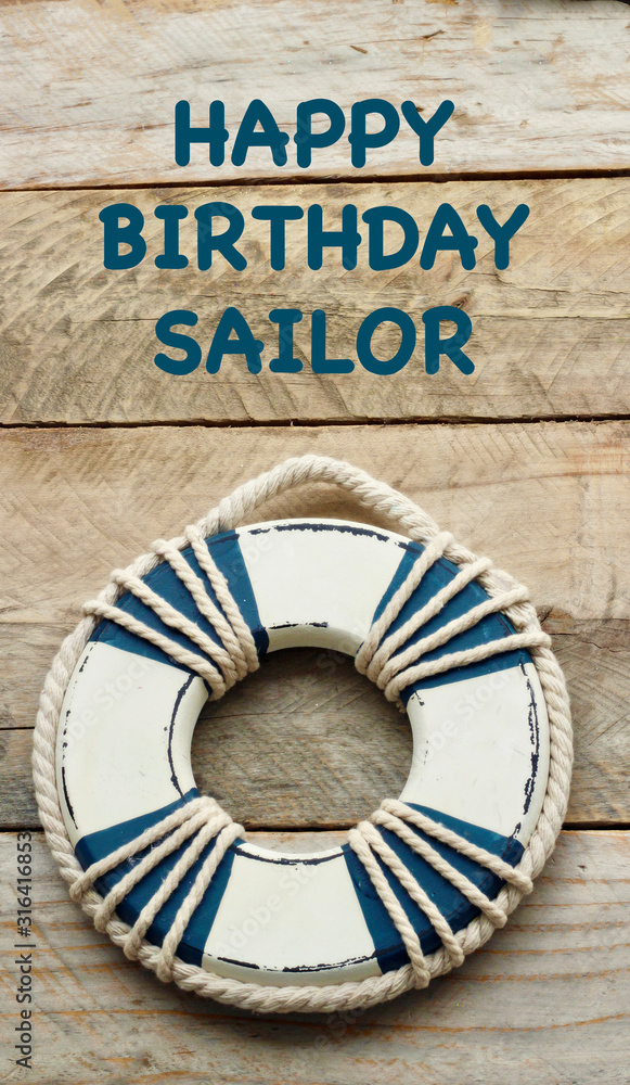 blue and white life preserver with happy birthday sailor message on a ...