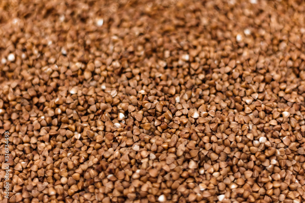 Buckwheat kernel texture. Grechka groats closeup. Wallpaper with ...