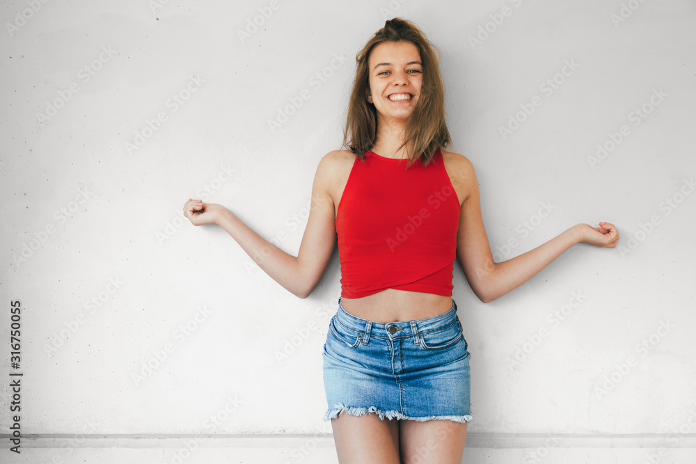 Cheerful teen girl laughing with open arms Stock Photo | Adobe Stock