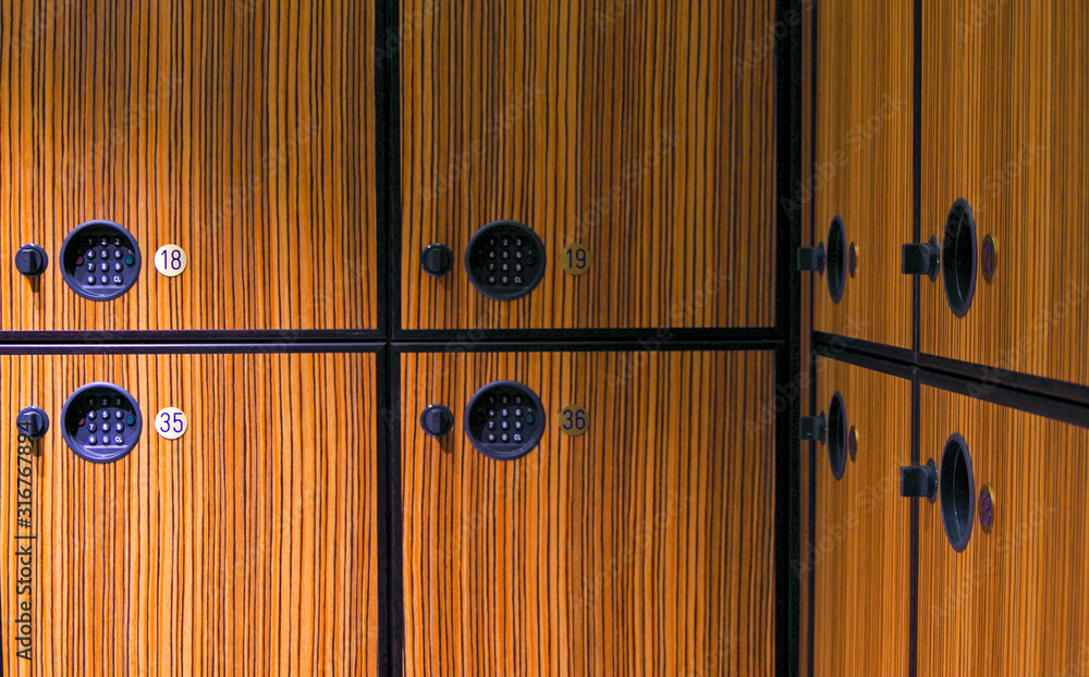 Electronic lockers inside changing or locker room in fitness center or ...