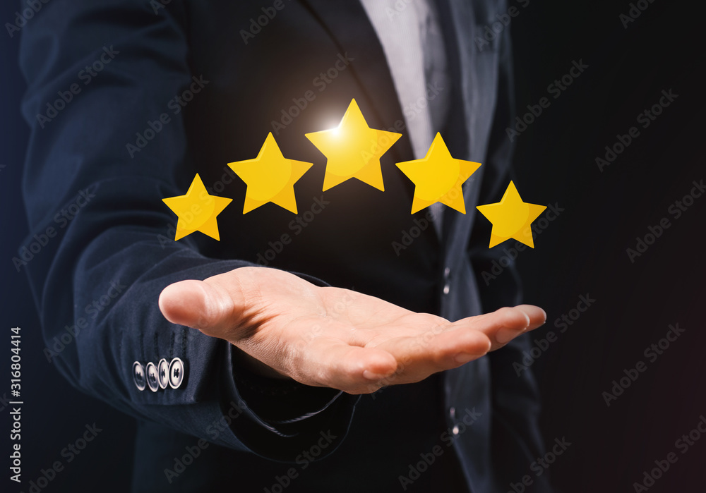 Unrecognizable Businessman Holding Five Stars Icons On Open Hand Stock ...